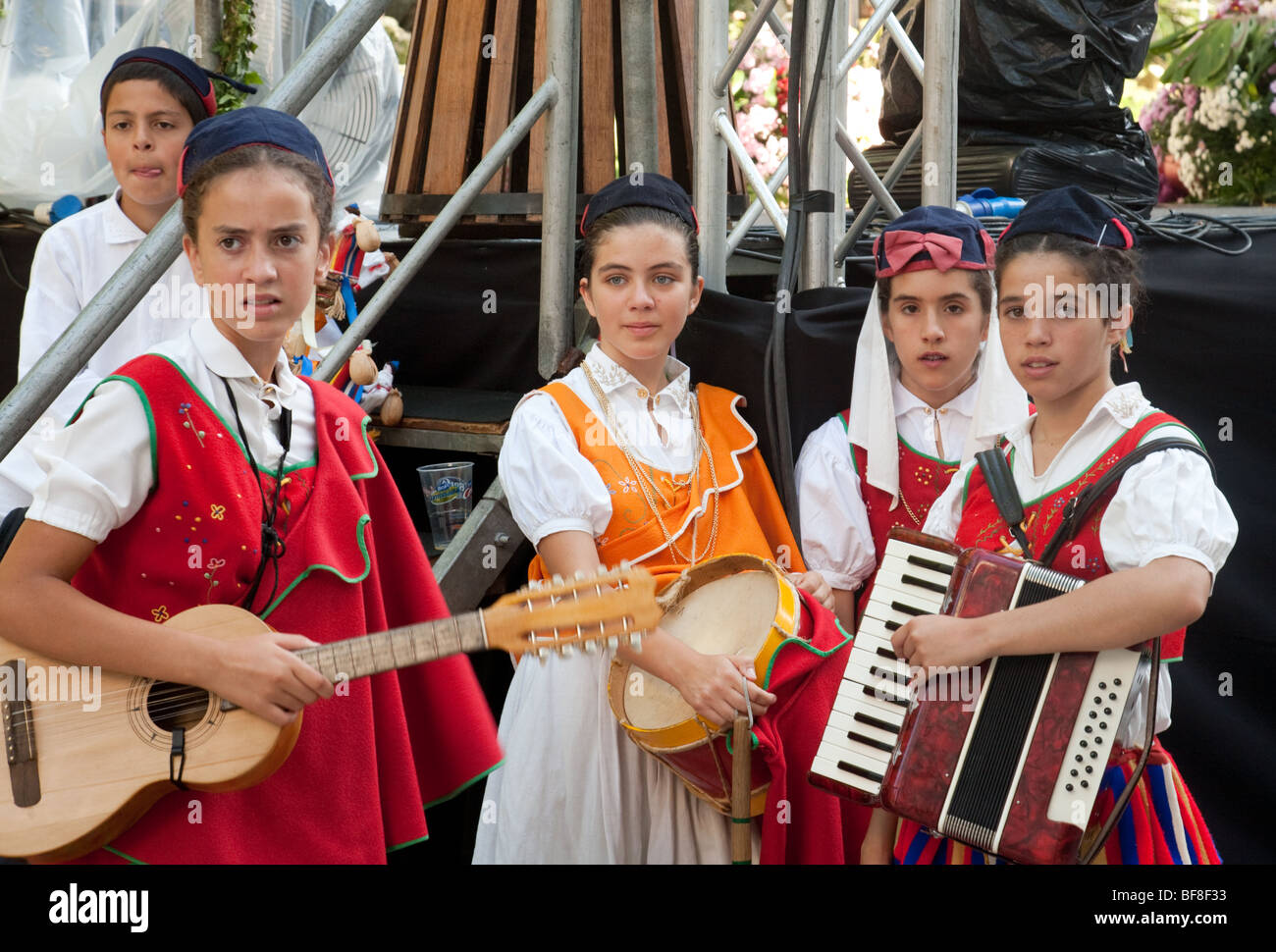 Madeiran children in traditional costume playing musical instruments ...