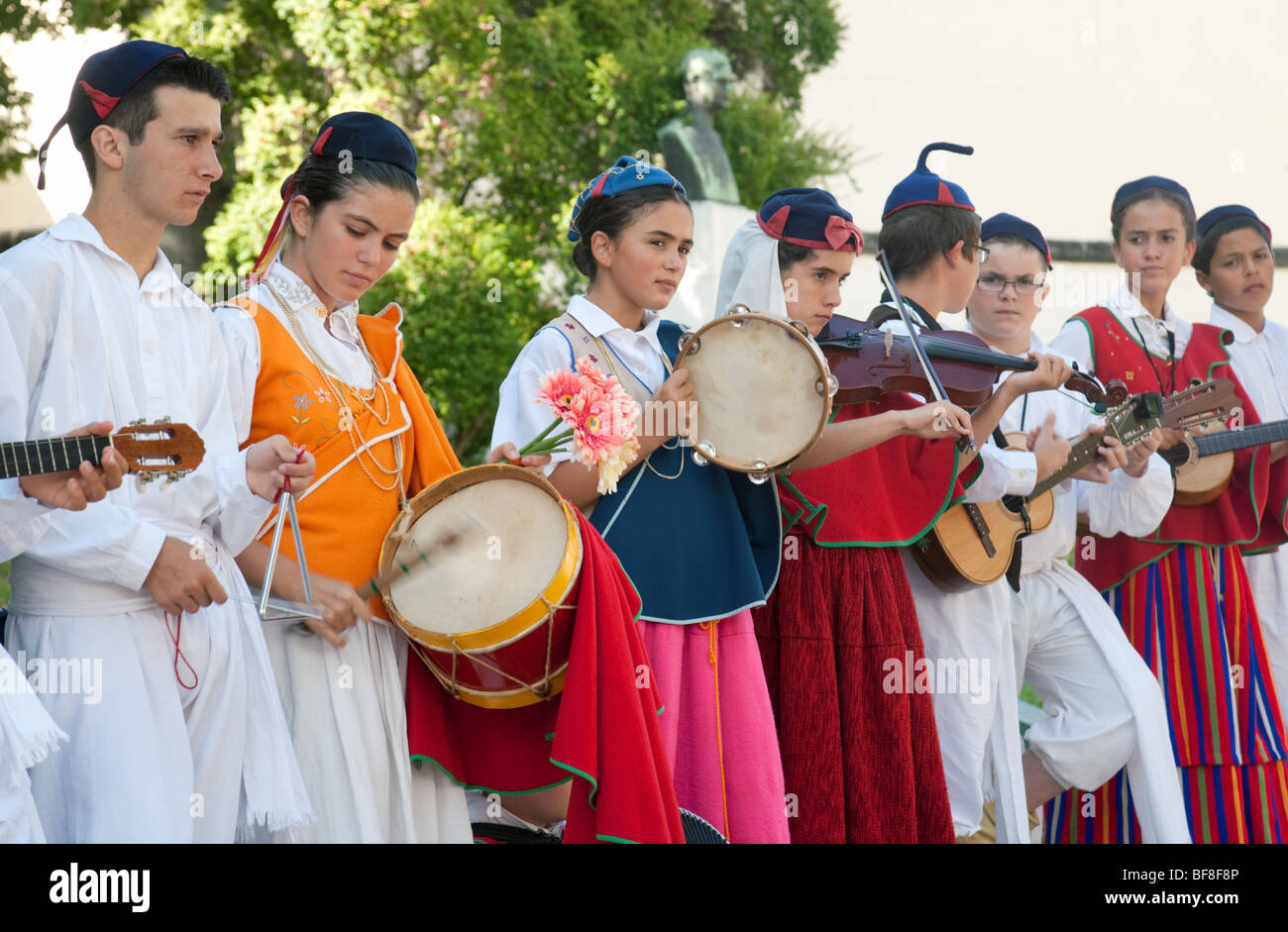 Madeiran children in traditional costume playing musical instruments ...
