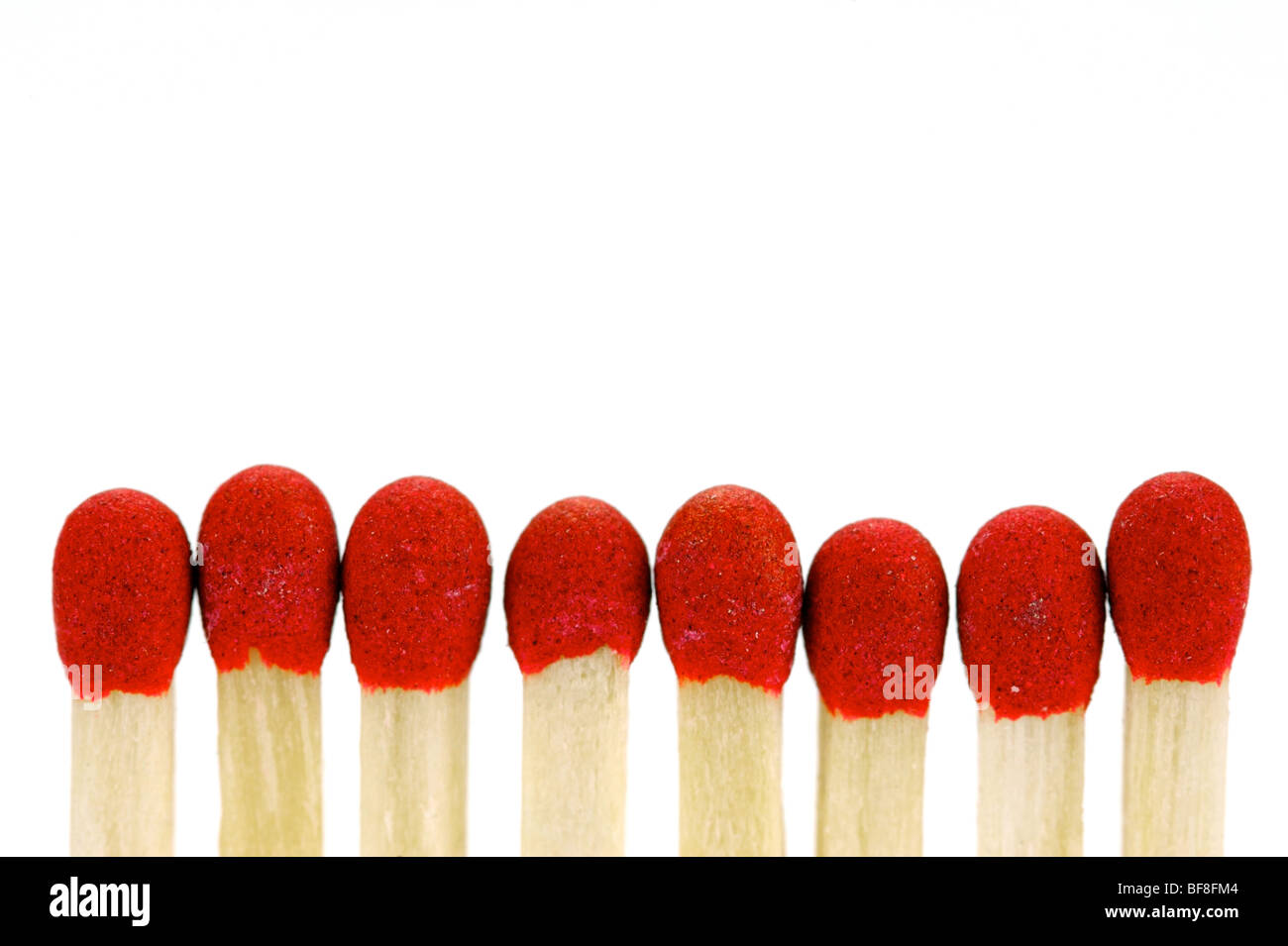 Red head matches isolated against a white background Stock Photo - Alamy