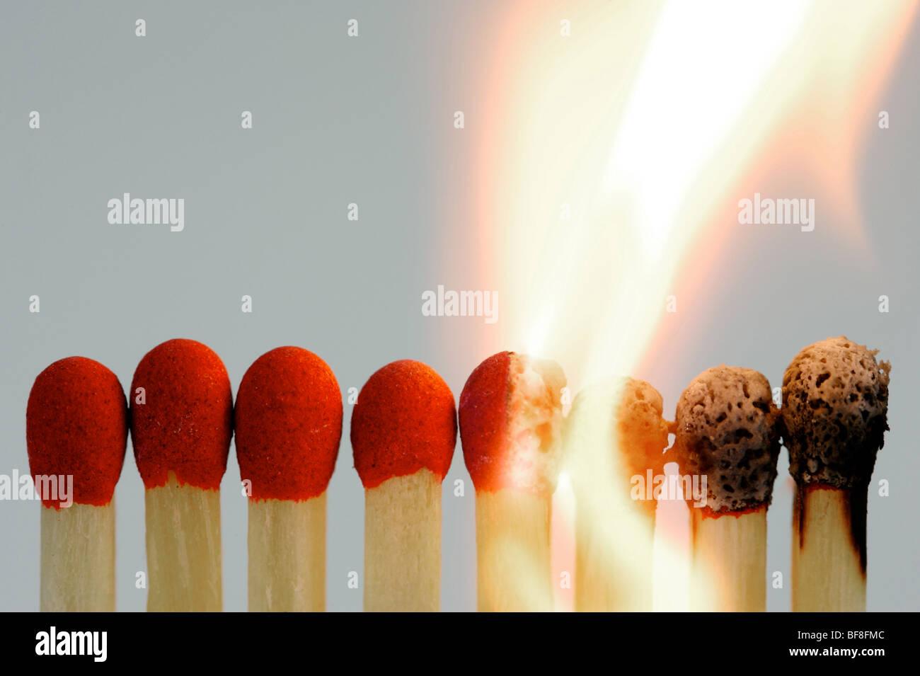 Red head matches isolated against a white background Stock Photo - Alamy