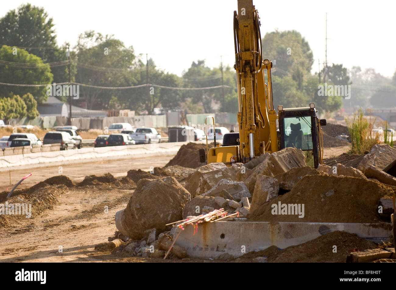 Earth moving, demolition, and pavement equipment line the side of the ...