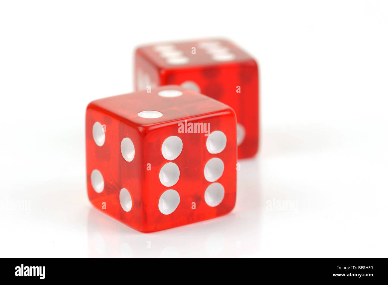 Dice isolated against a white background Stock Photo - Alamy