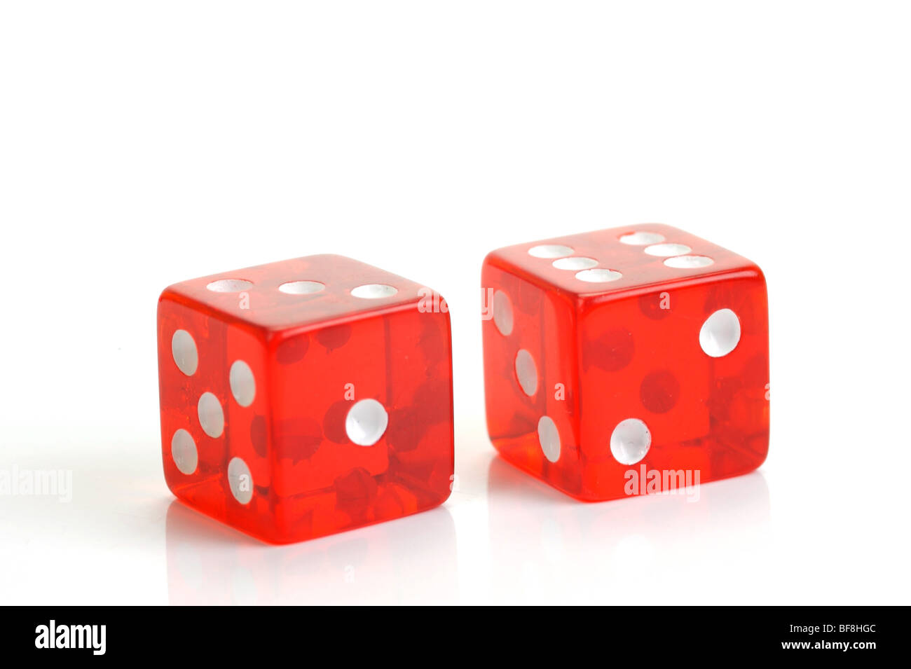 Dice isolated against a white background Stock Photo - Alamy