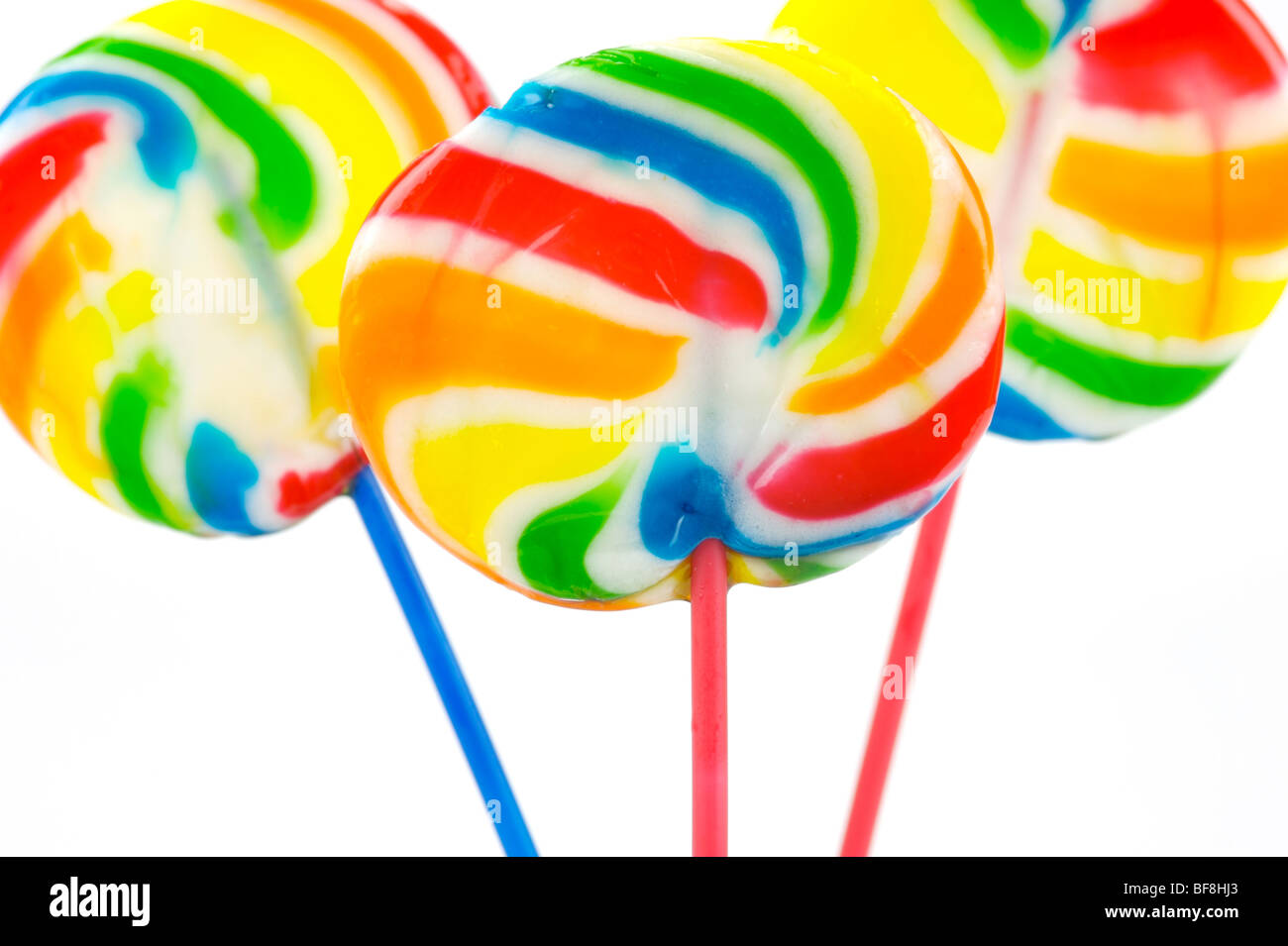 Lolly pops isolated against a white background Stock Photo - Alamy