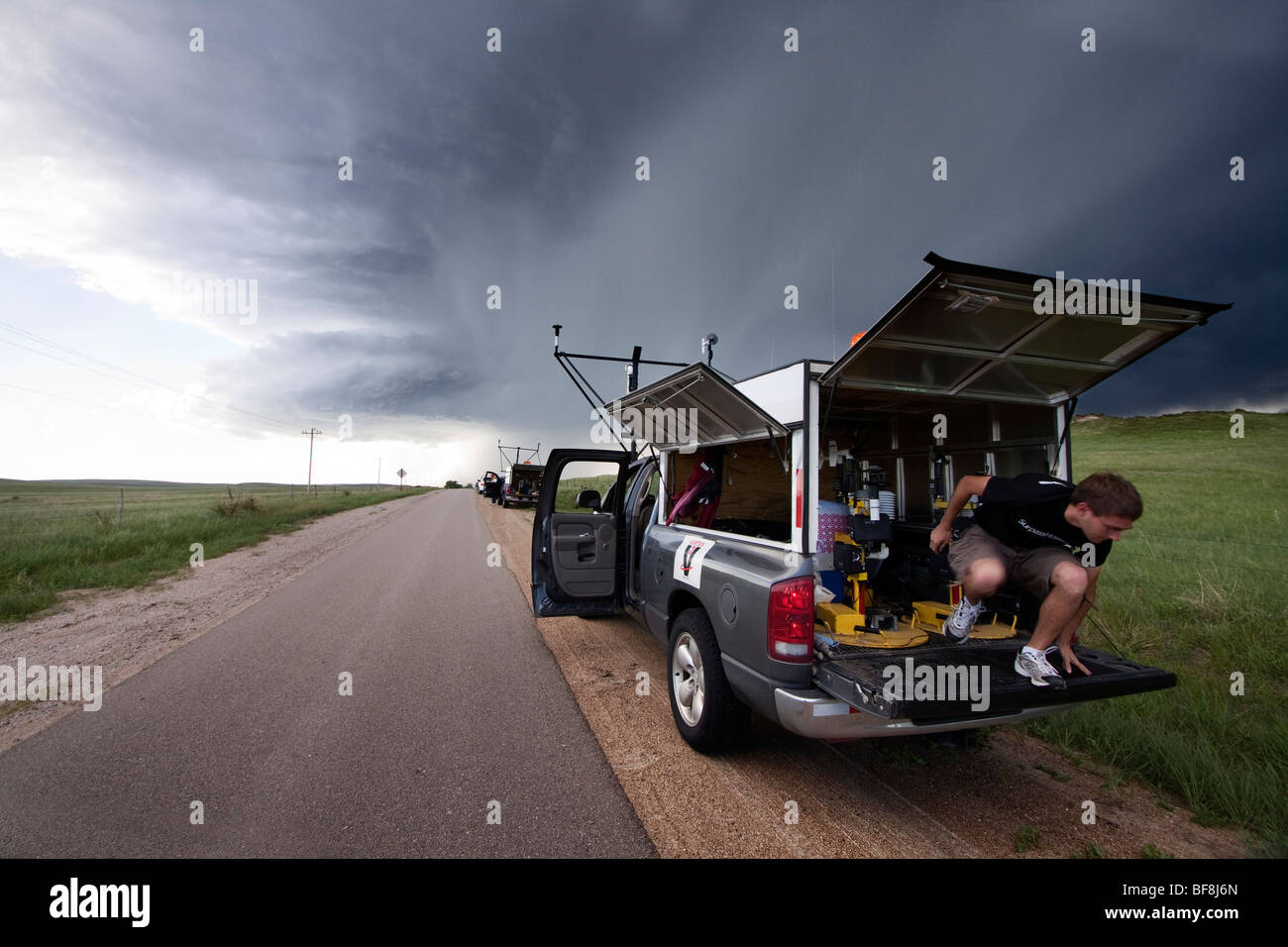 Scientists participating in Project Vortex 2 park along a road to ...