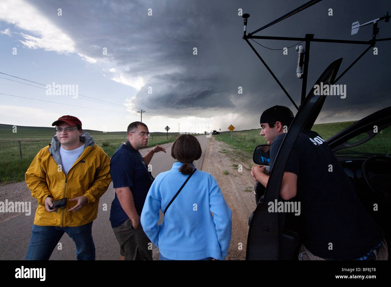 Scientists participating in Project Vortex 2 park along a road to ...