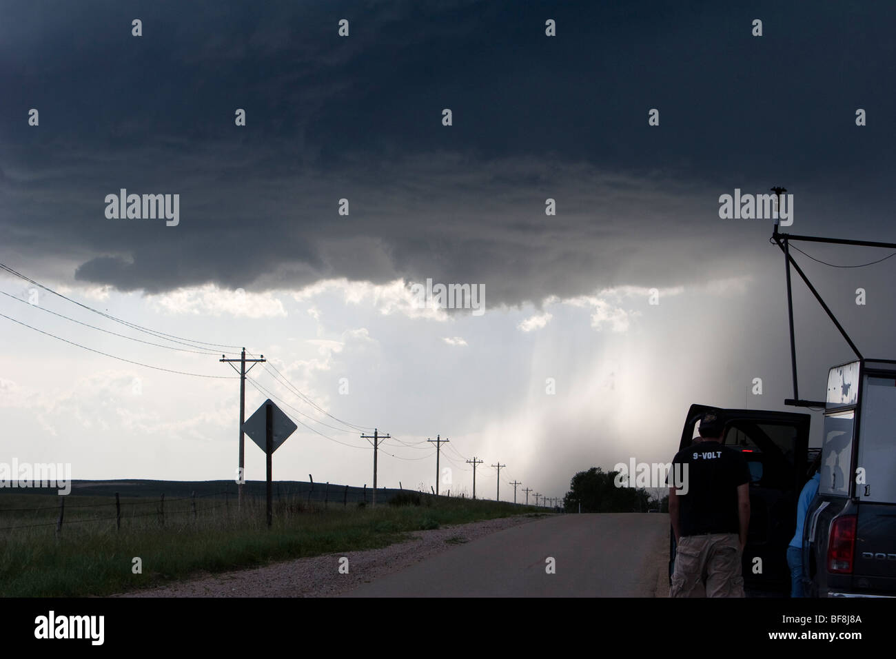 Scientists participating in Project Vortex 2 park along a road to ...