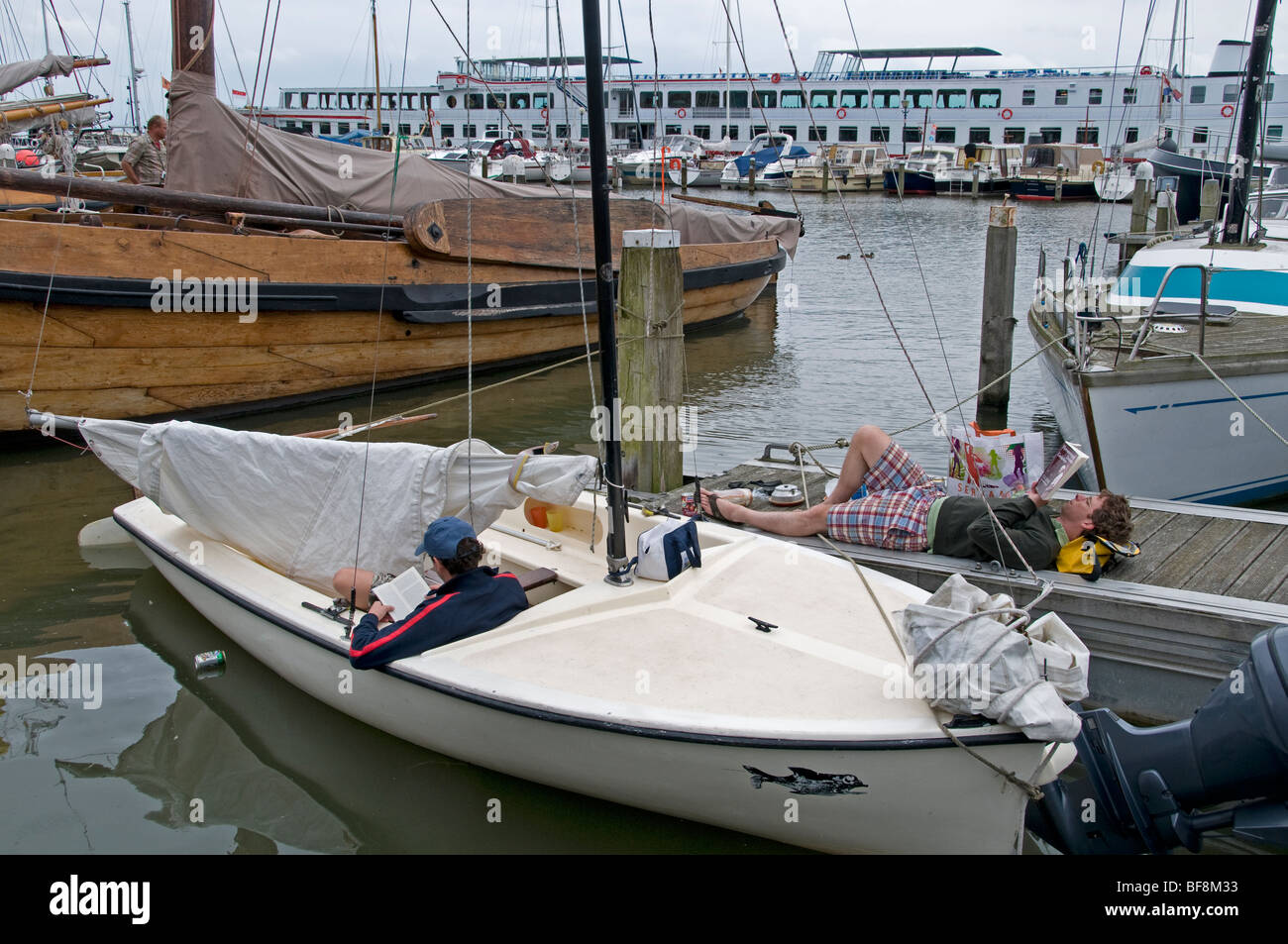 Port Volendam Netherlands sailing boat IJsselmeer reading a book lazy ...