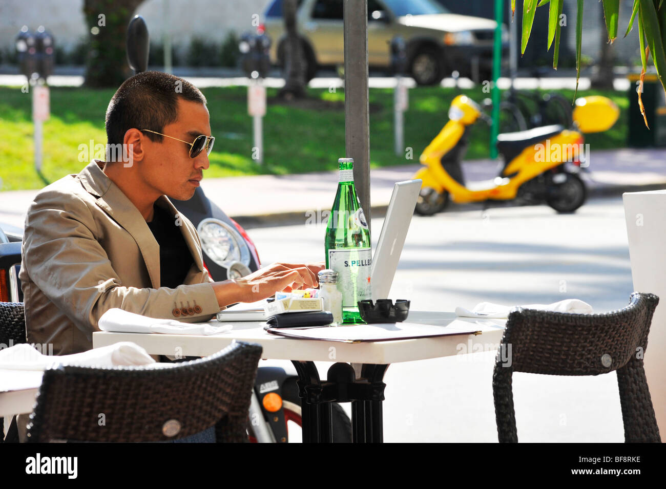 Asian man relaxing in South Beach Miami Stock Photo - Alamy