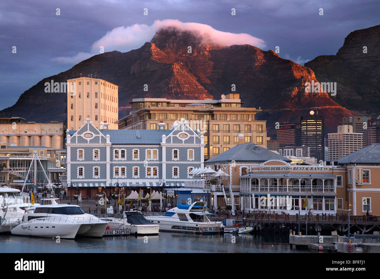 Cloud hangs over Table Mountain at sunset, the Victoria and Alfred ...