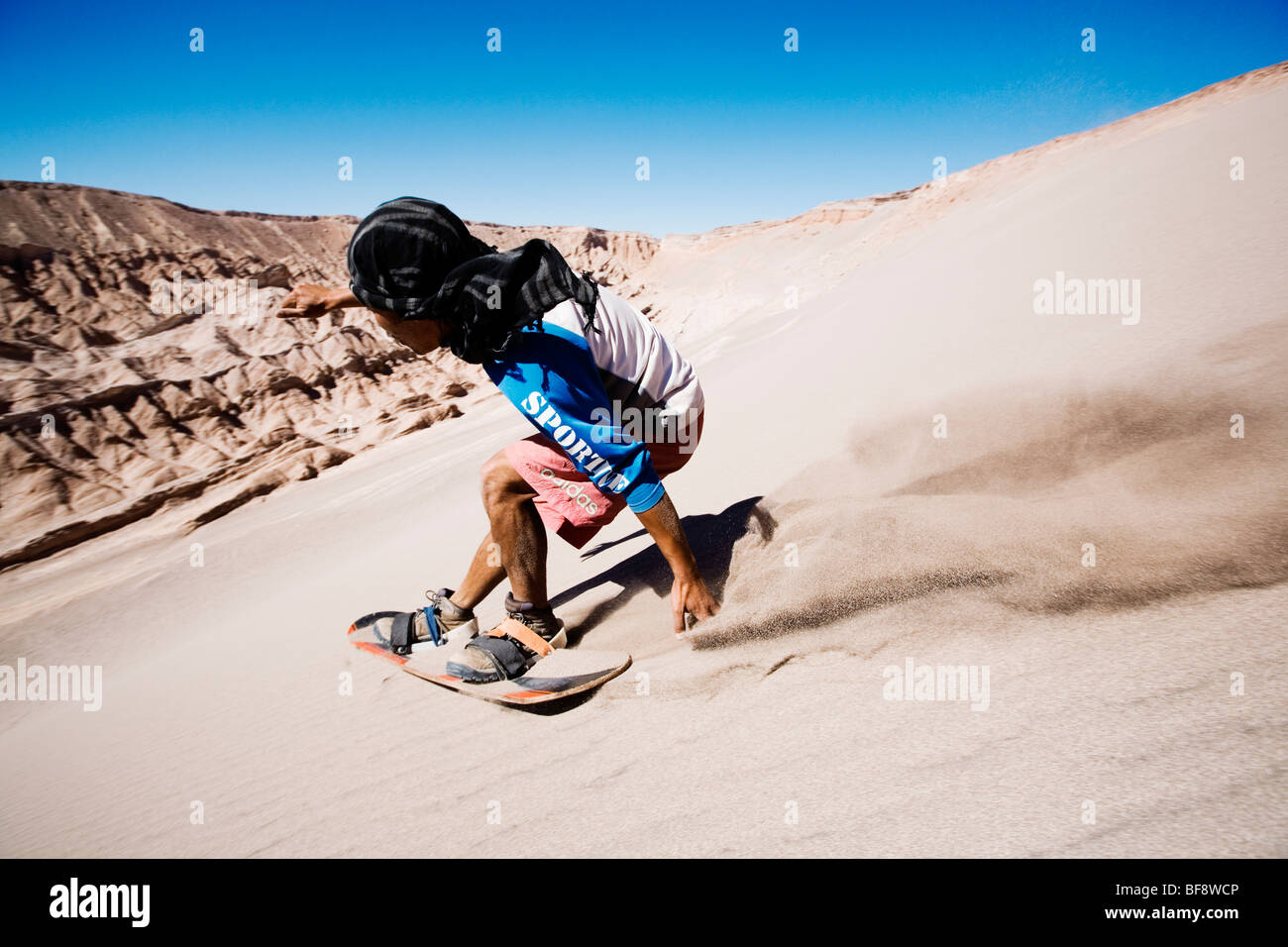 Sand boarding on sand dunes in the Death Valley near San Pedro de ...