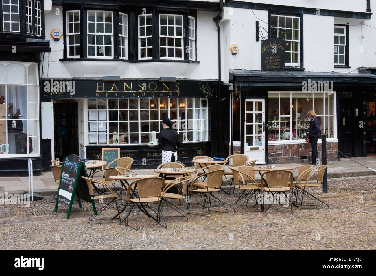 shops and cafes along cathedral close in Exeter Stock Photo - Alamy