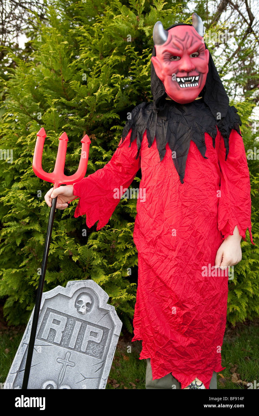 Halloween mask and RIP grave headstone Stock Photo - Alamy
