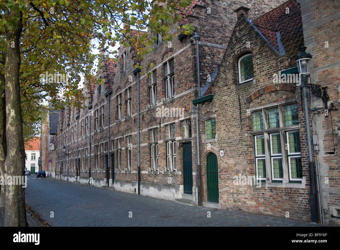 Row of terraced Gothic-style houses on Potterierei Bruges Belgium Stock ...
