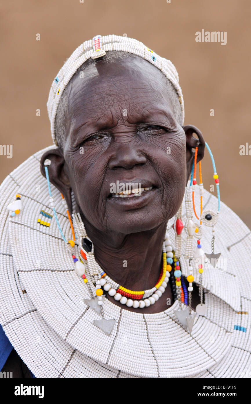 Elderly Masai Woman Wearing Engarewa Necklace In Engaruka Village, Rift ...