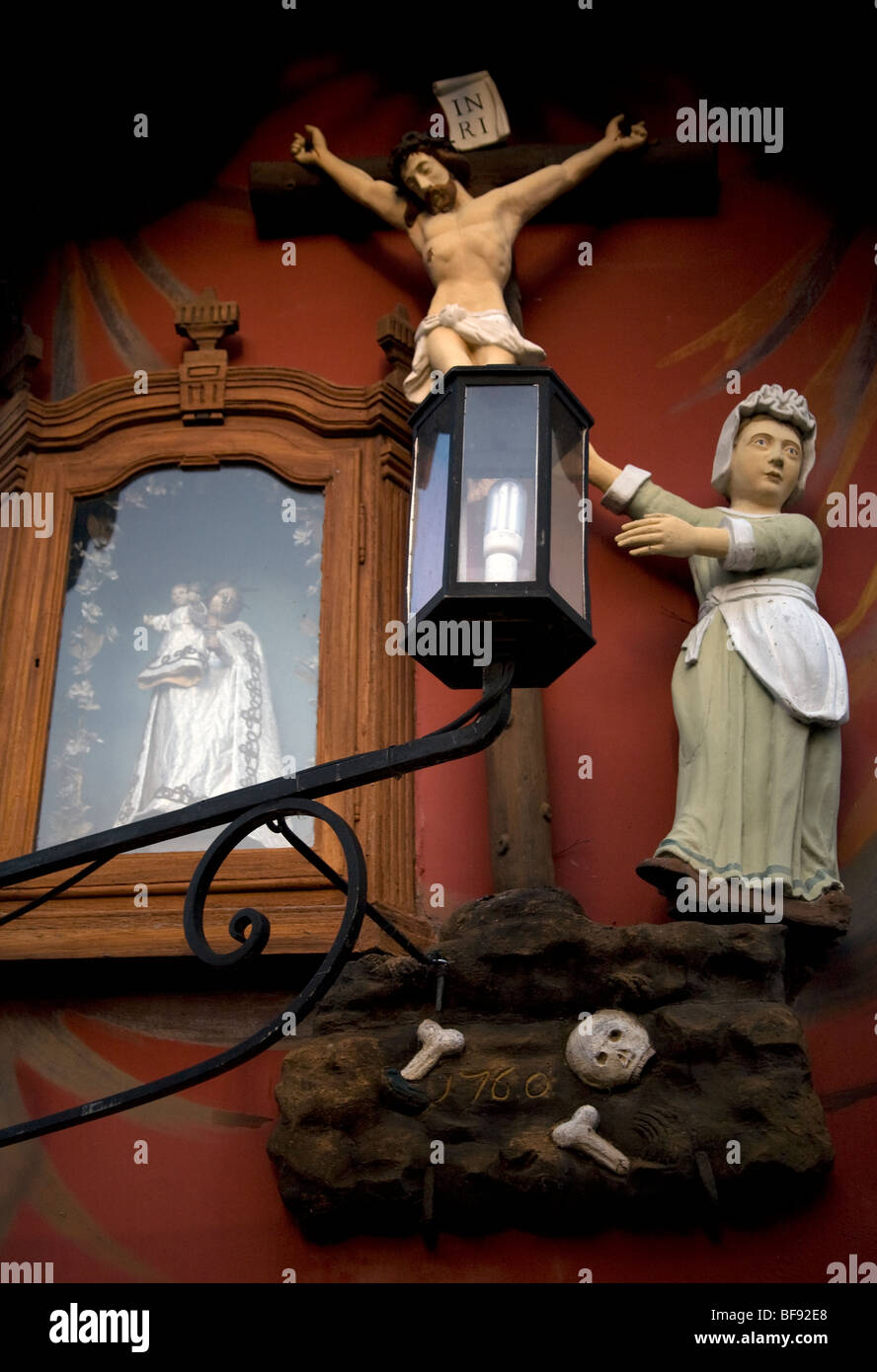 Religious scene depicting Jesus on the cross, on a wall in Bruges ...