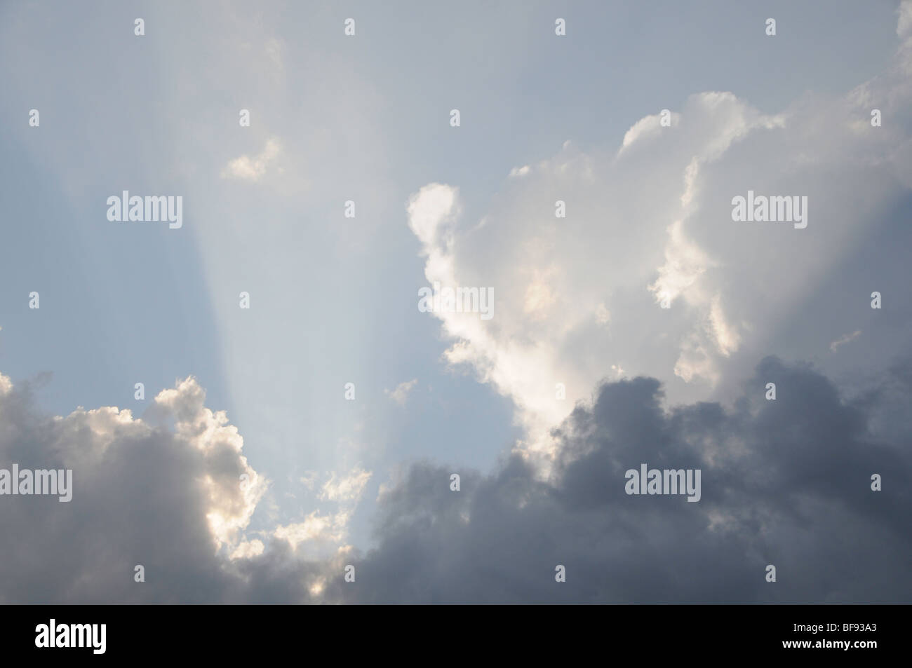 Sun Rays Shining Through Clouds Stock Photo - Alamy