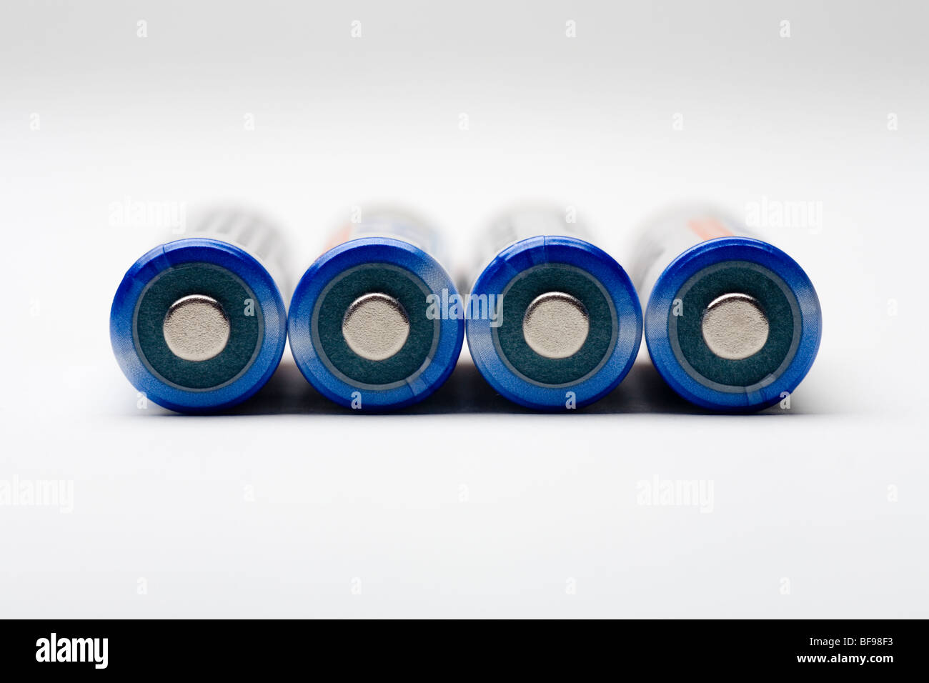 Close up view of 4 AA batteries Stock Photo - Alamy