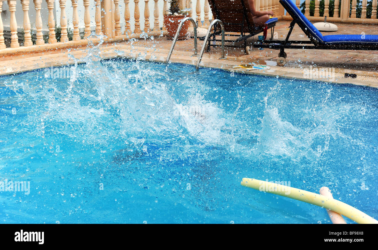 Man jumps swimming pool hi-res stock photography and images - Alamy