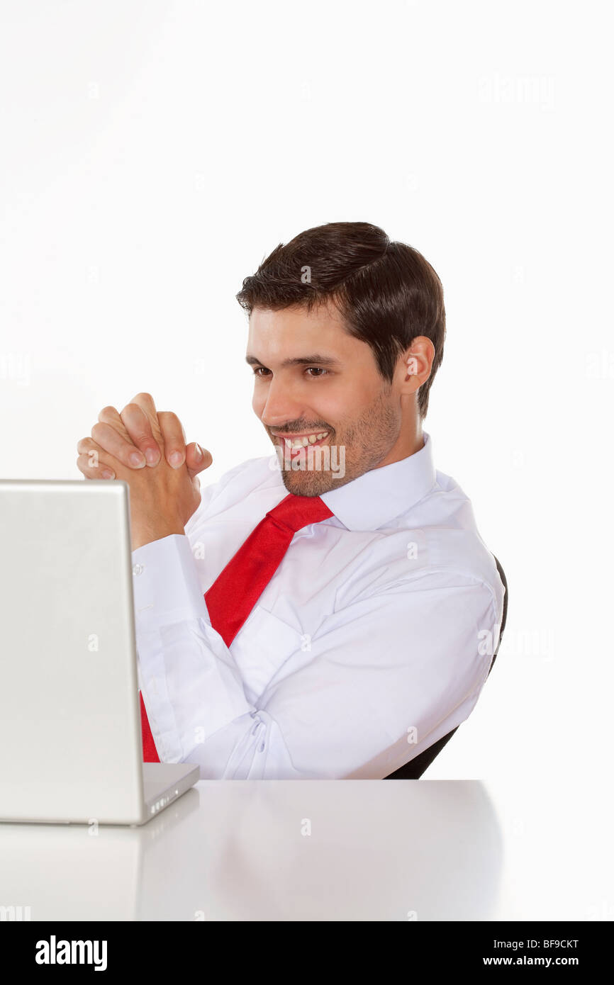 young business executive in white shirt behind desk with laptop Stock ...