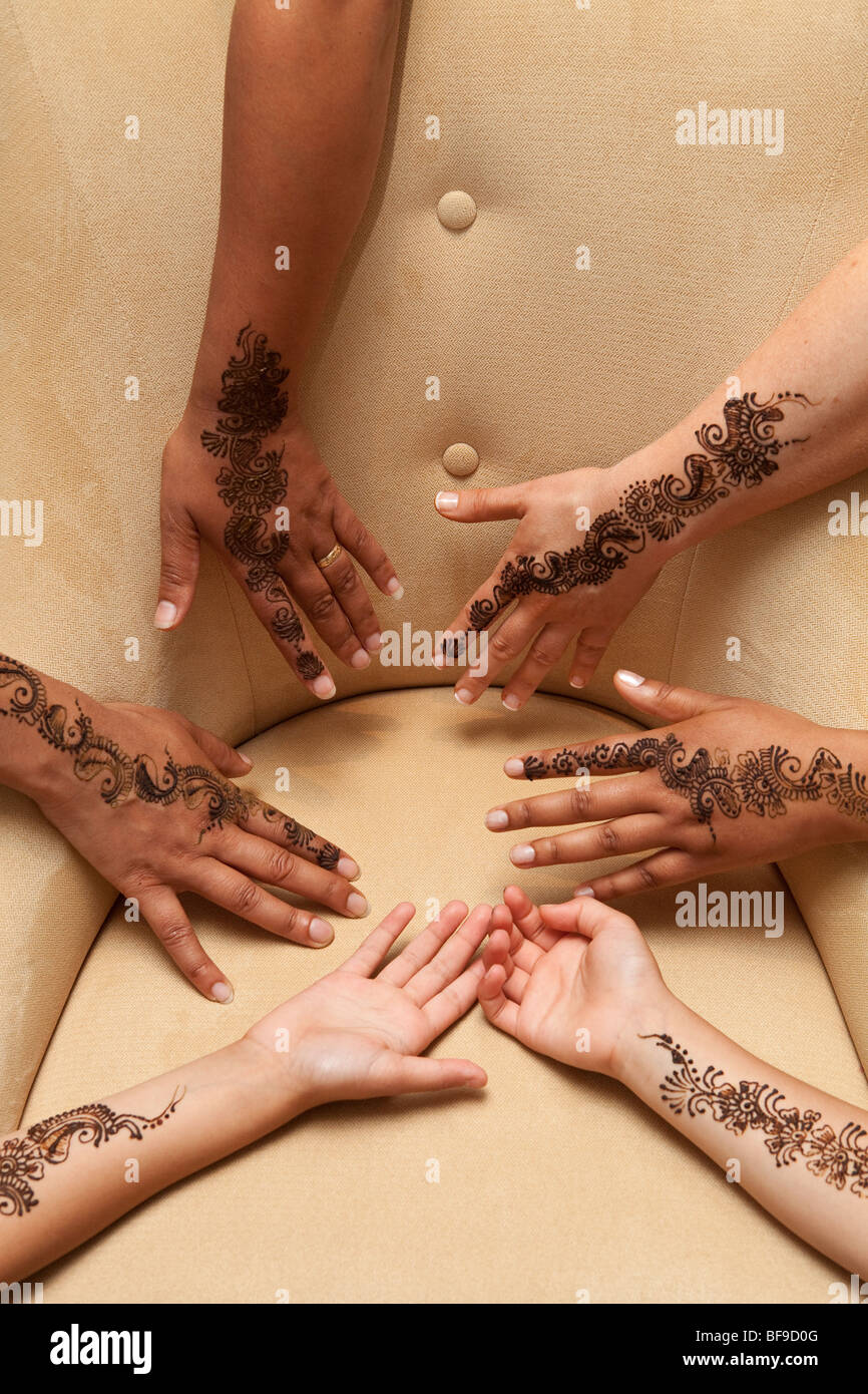 Many hands with henna Stock Photo - Alamy