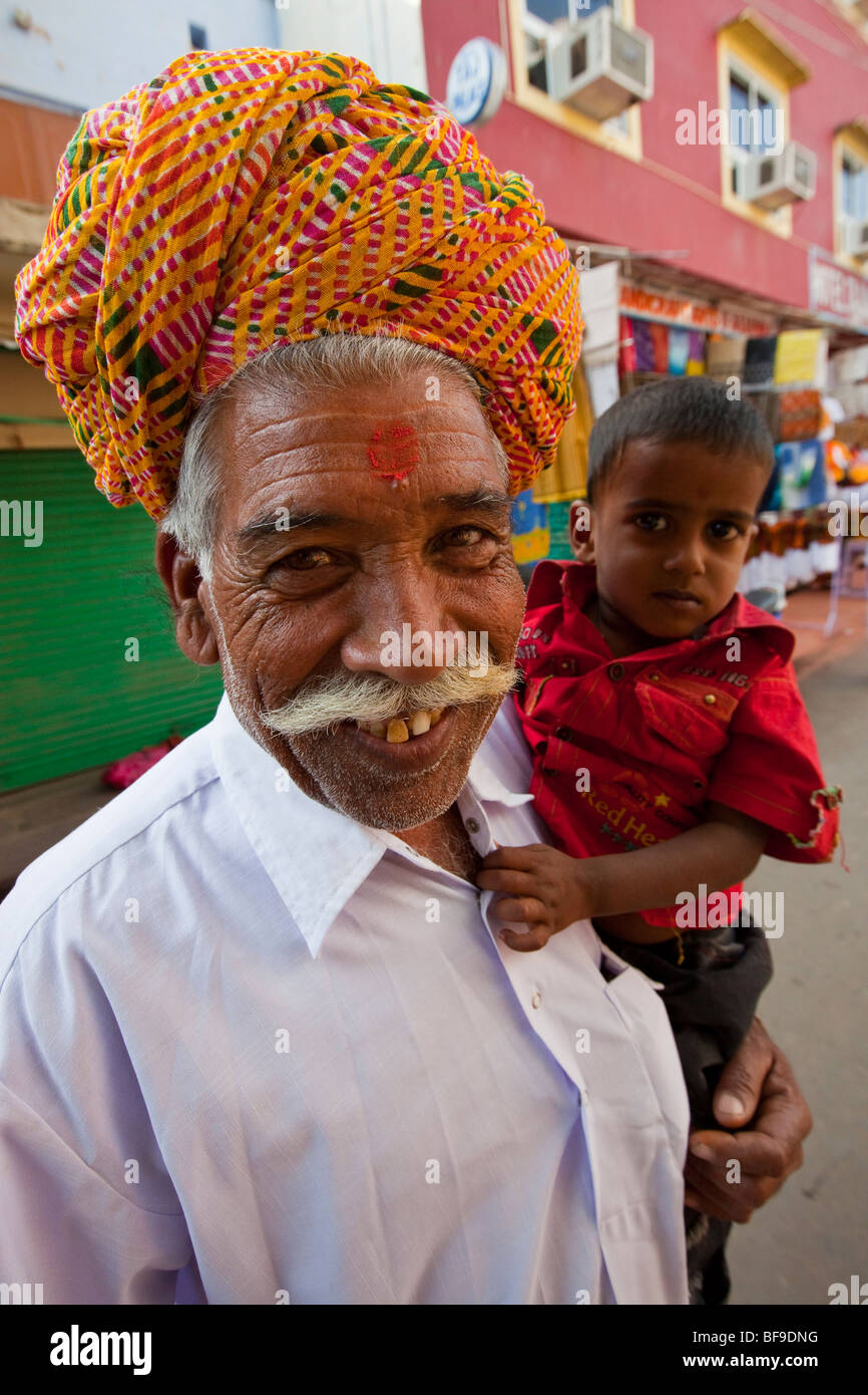 Rajput man and his grandson at Sadar Bazaar in Pushkar in Rajasthan ...