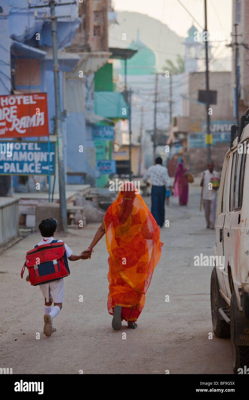 Rajput mother walking child to school in Pushkar in Rajasthan India ...