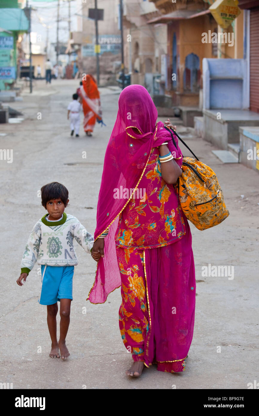 Rajput mother walking child to school in Pushkar in Rajasthan India ...