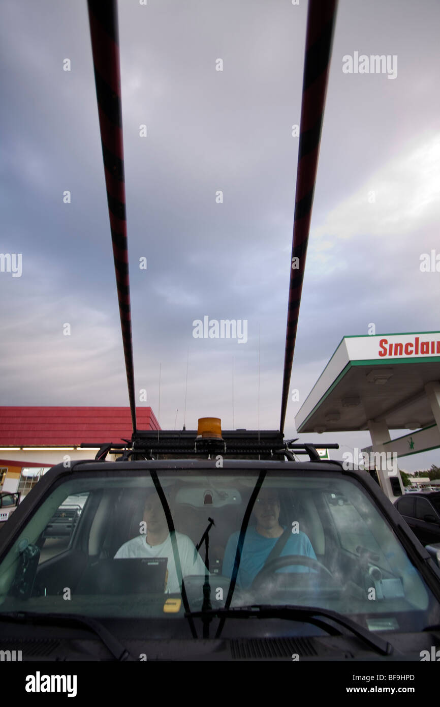Scientists participating in Project Vortex 2 park at a gas station in ...