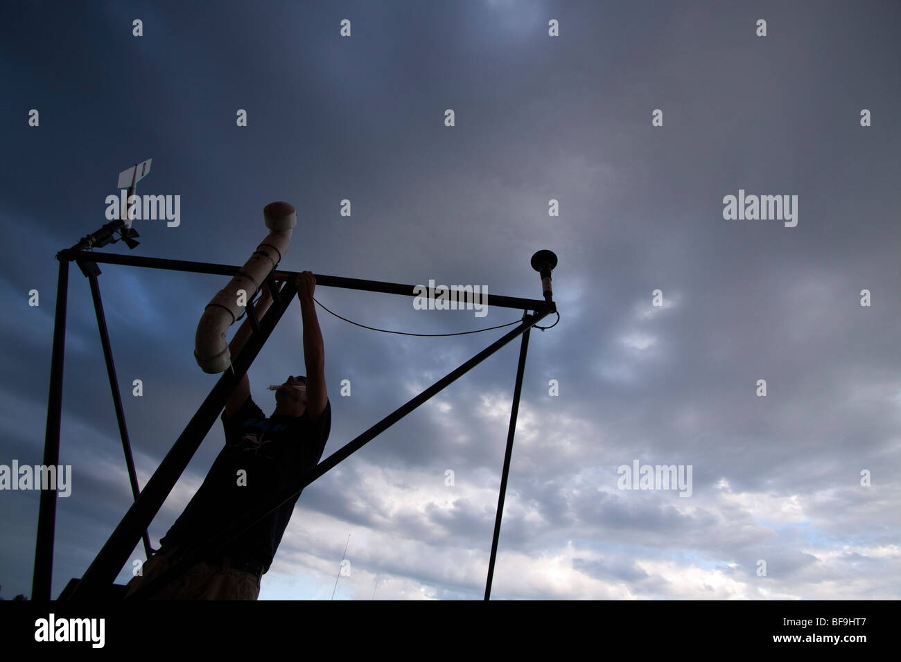 A scientist with Project Vortex 2 adjusts weather instrumentation on ...