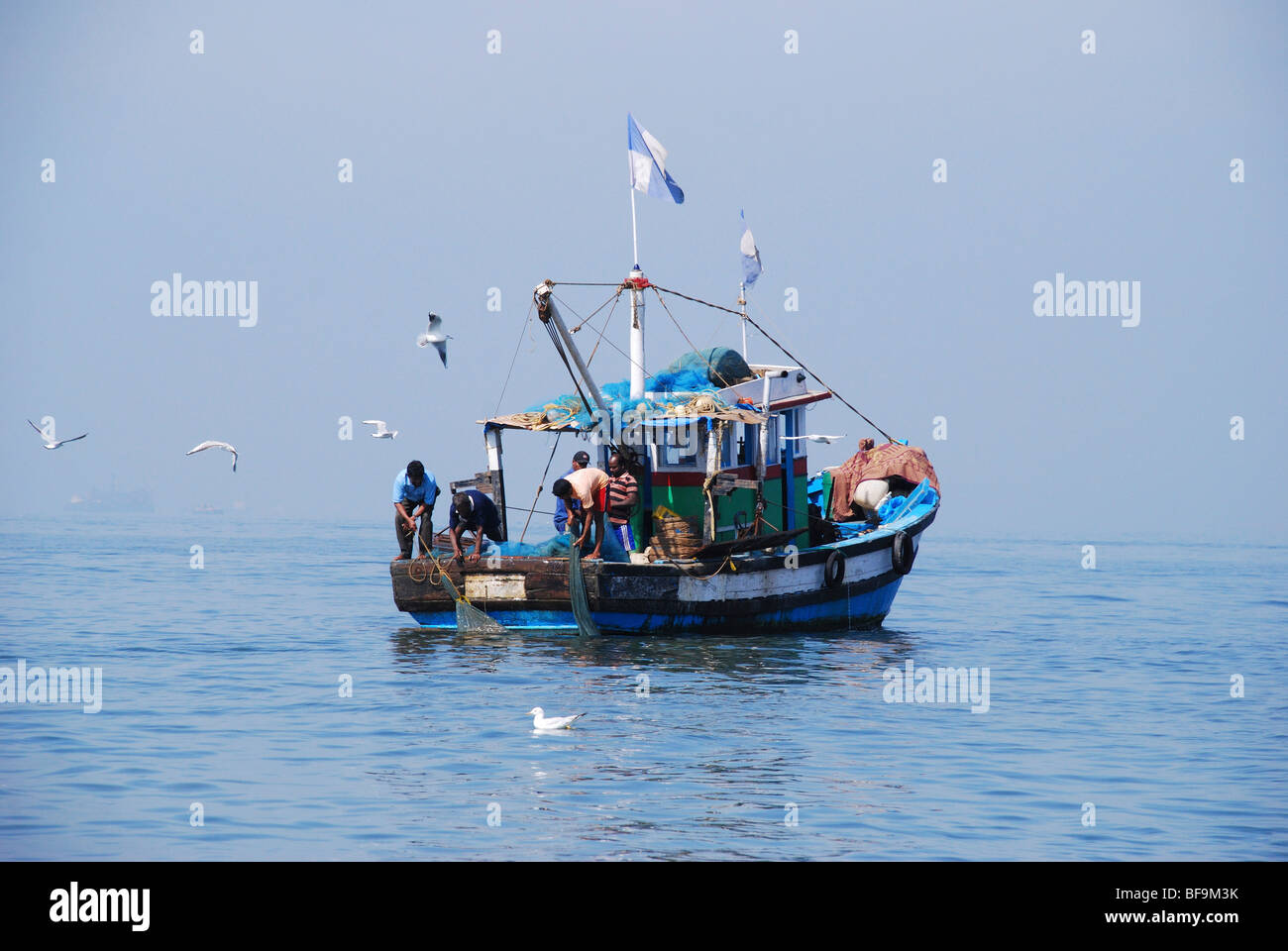 Fishermen in Fishing boat Stock Photo - Alamy