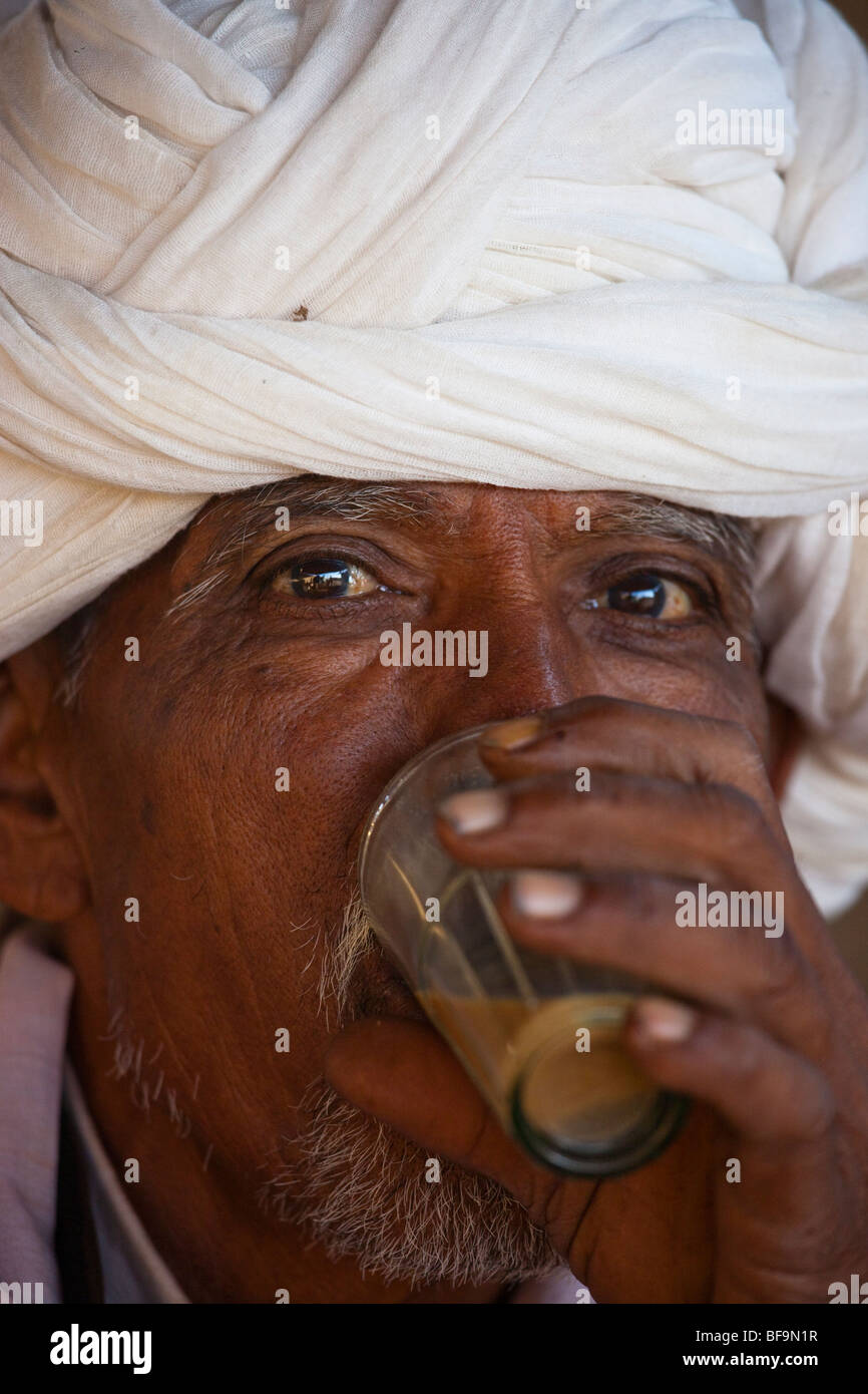 Rajput man drinking chai at the Camel Fair in Pushkar in Rajasthan ...