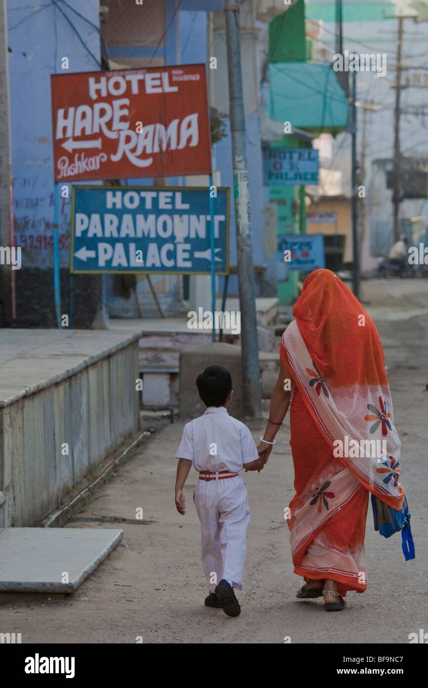 Rajput mother walking child to school in Pushkar in Rajasthan India ...