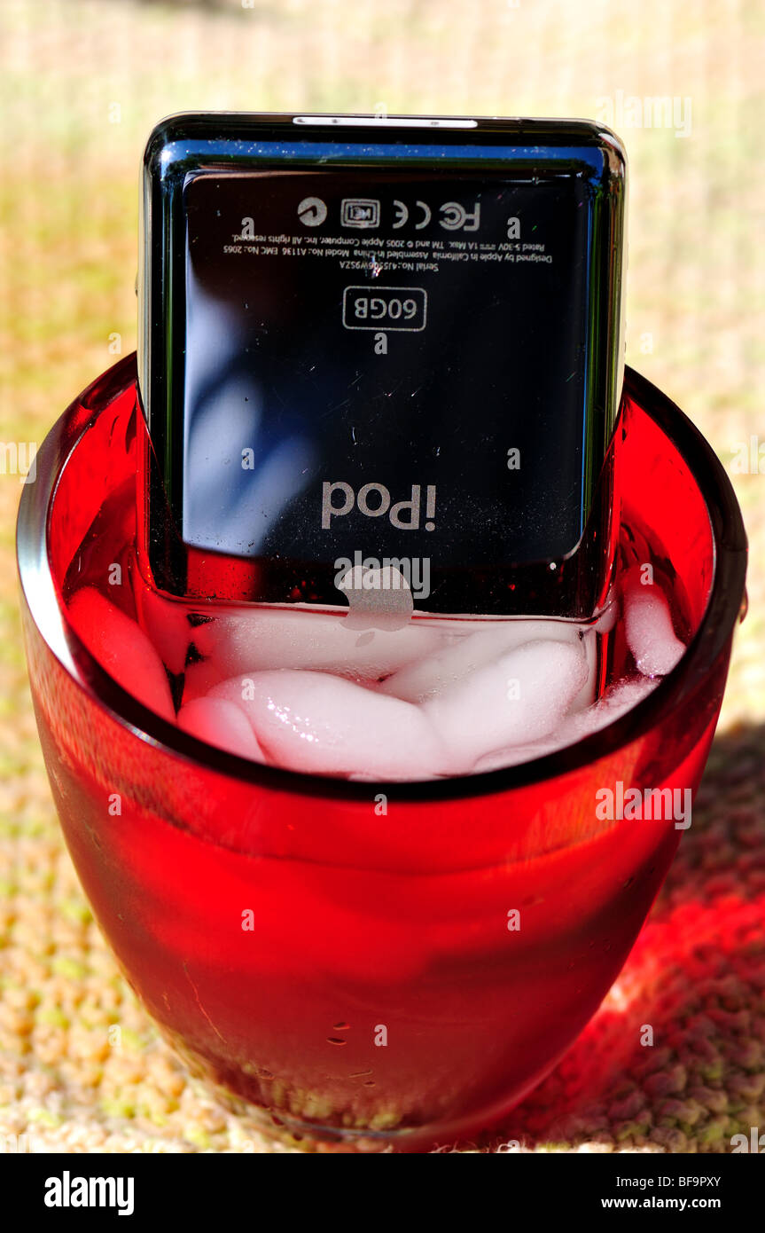 An Ipod dropped in a glass of ice water Stock Photo - Alamy