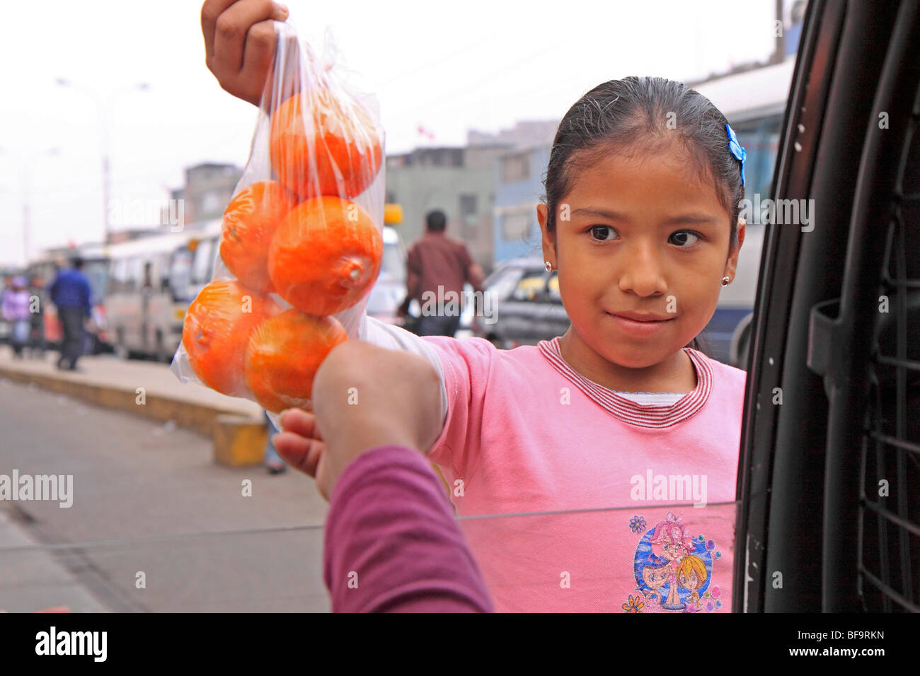 young girl working in the streets of Lima, Peru Stock Photo - Alamy