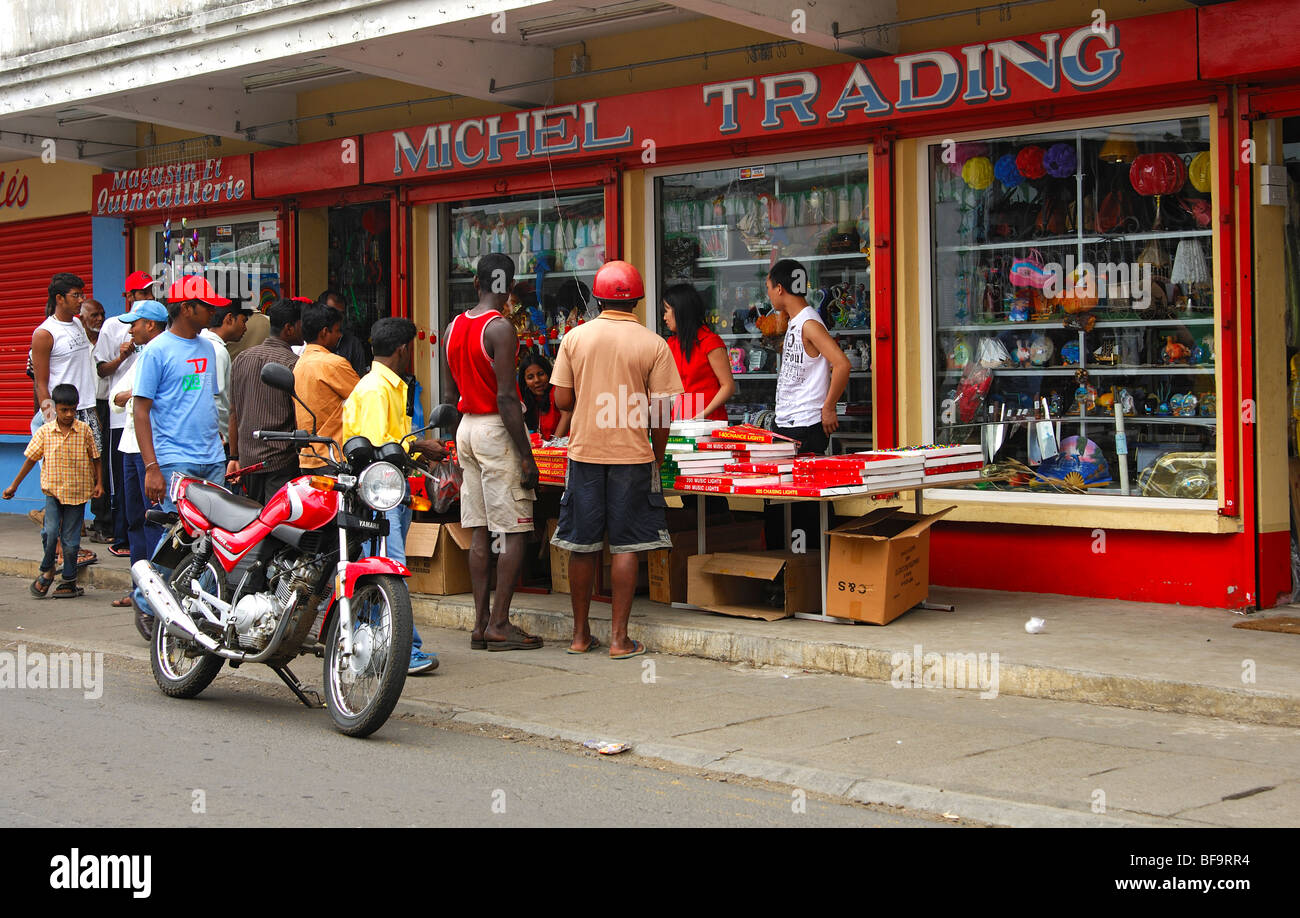 Street szene in front of a local shop in the town of Chemin Grenier ...