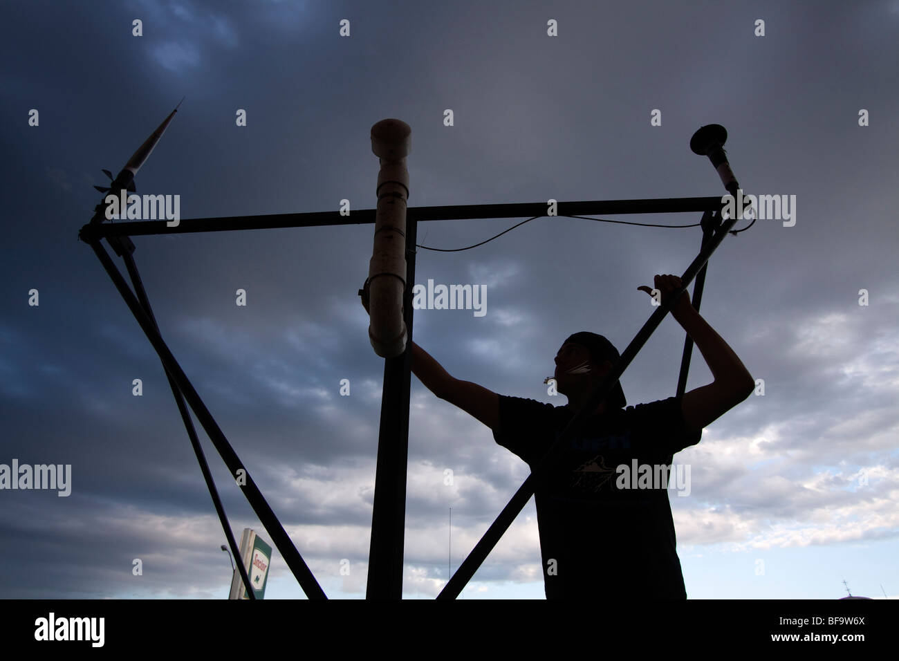 A scientist with Project Vortex 2 adjusts weather instrumentation on ...