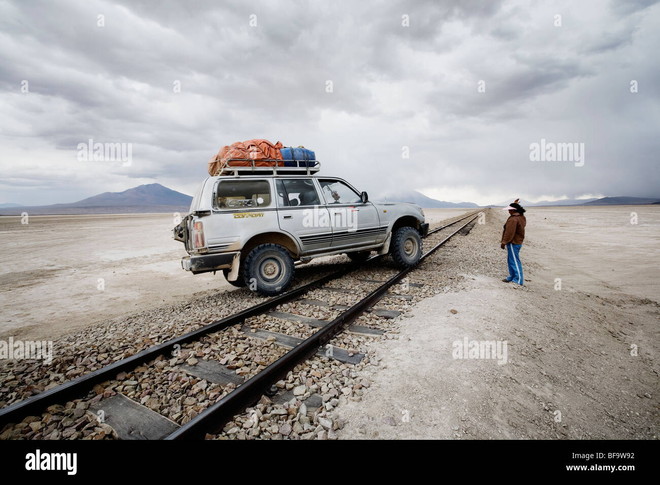 Jeep crossing railroad somewhere in Southwest Bolivia Stock Photo - Alamy