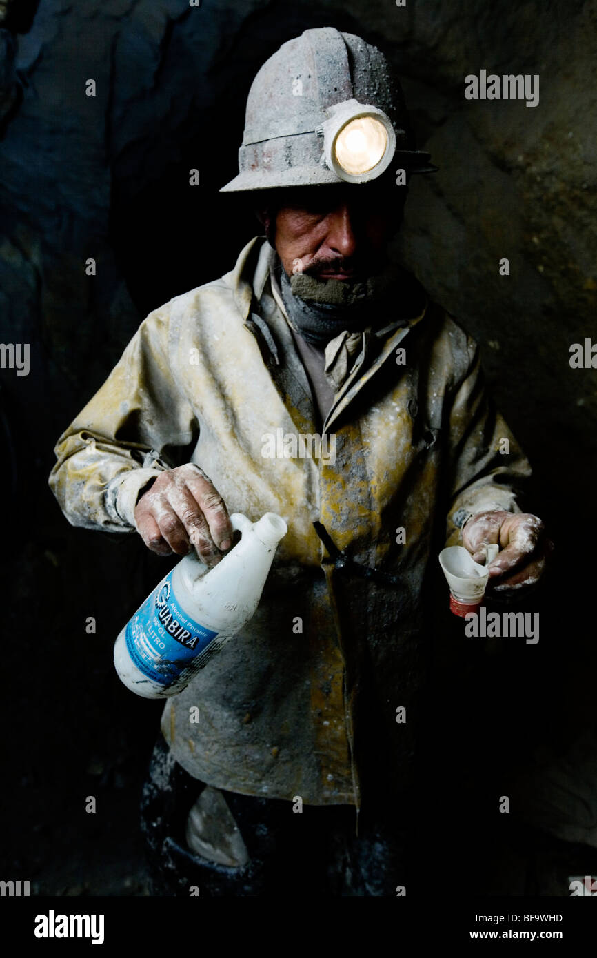 Miner drinking alcohol inside Cerro Rico mountain, Potosi, Bolivia ...