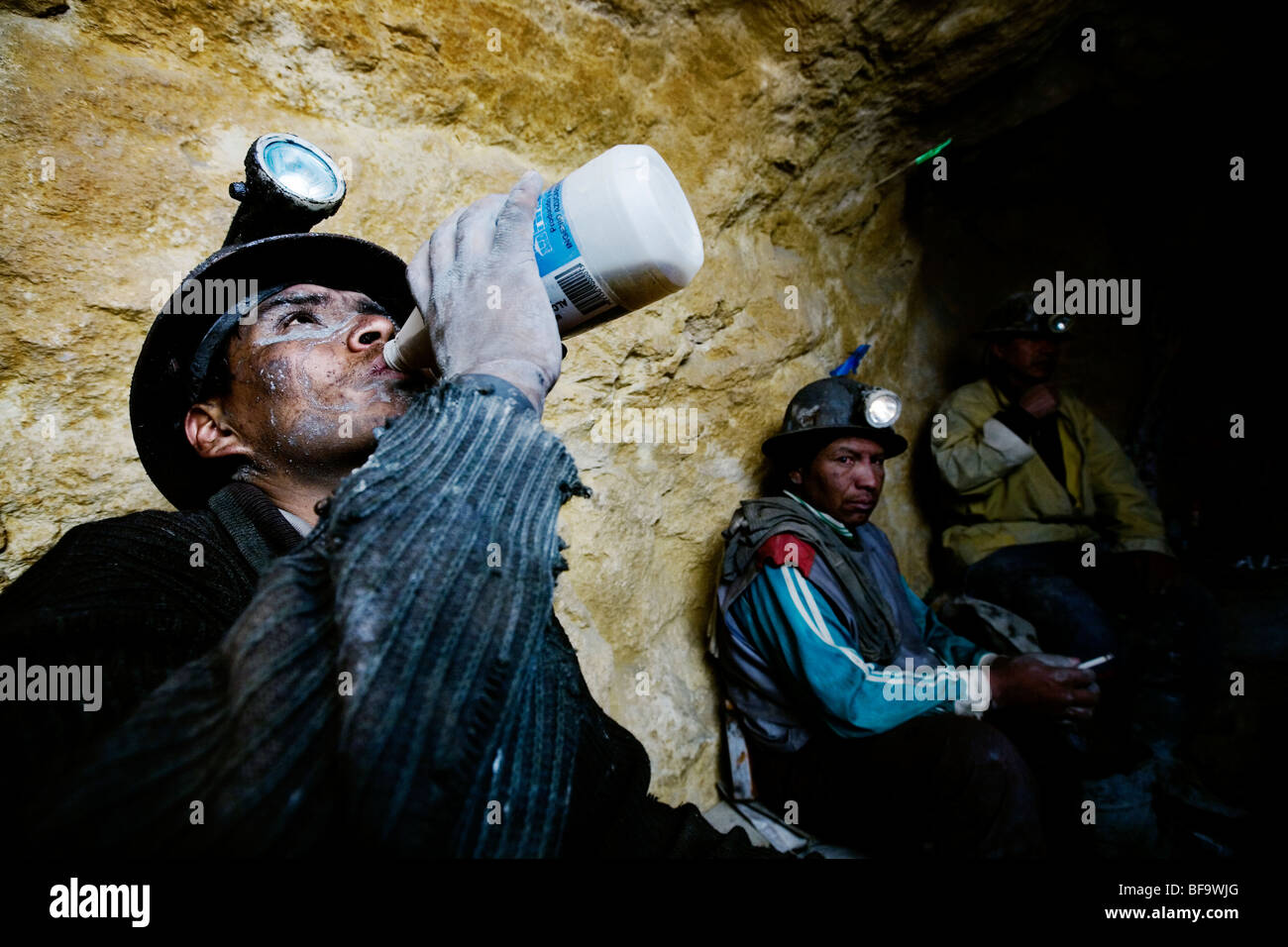 Miners drinking alcohol inside Cerro Rico mountain, Potosi, Bolivia ...