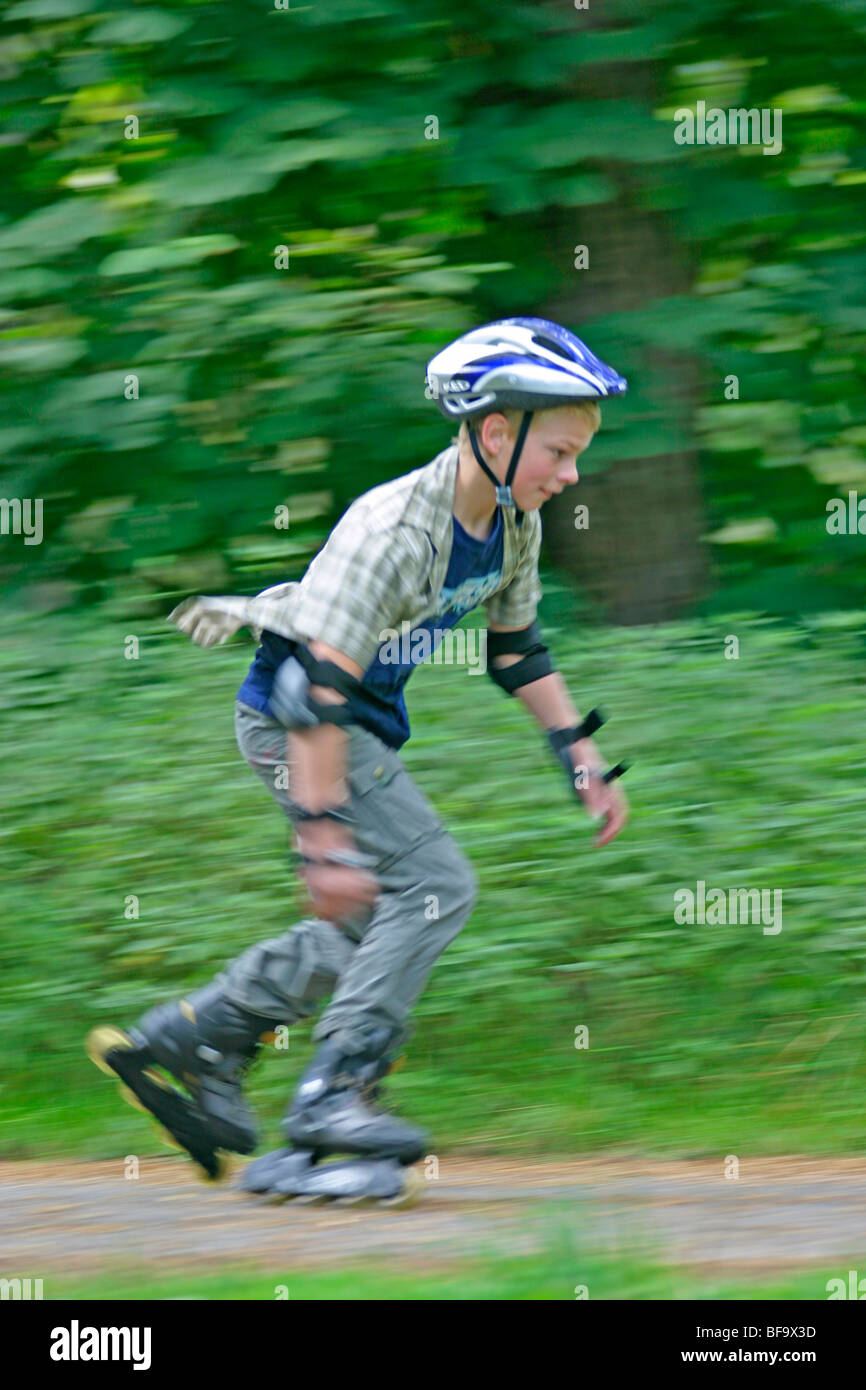 young boy in-line skating Stock Photo - Alamy