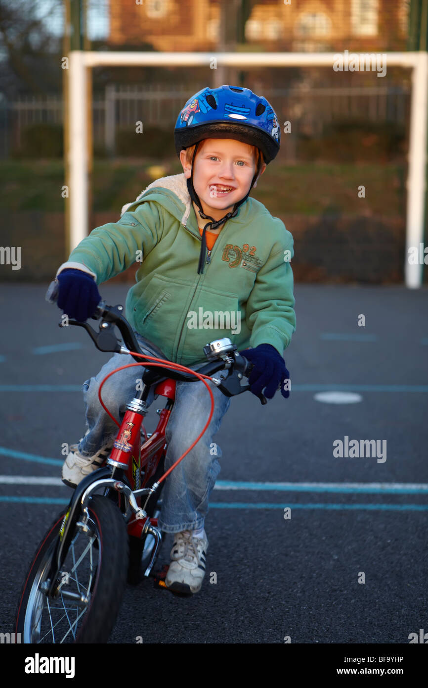 Young Boy Riding Bike Stock Photo - Alamy
