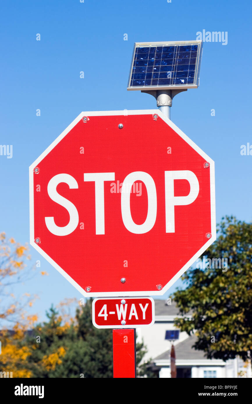 STOP sign powered by a solar battery Stock Photo - Alamy
