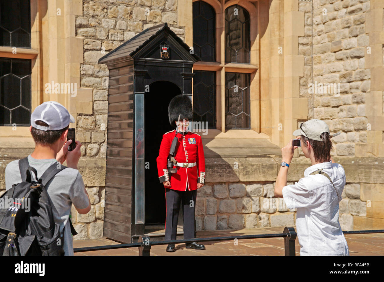 teenage boys taking a photo of a Guard at Waterloo Barracks at the ...