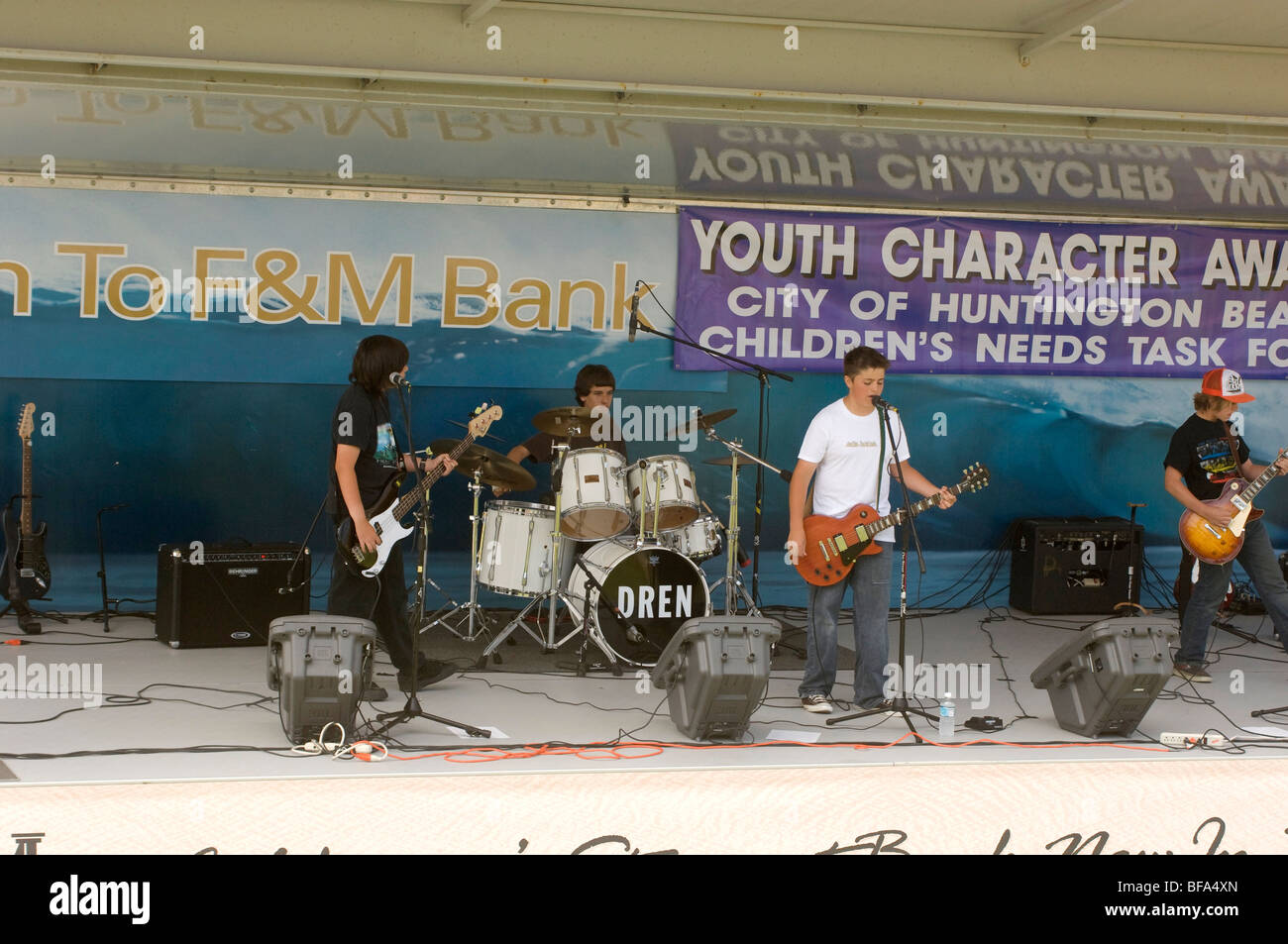 A band of young teenage musicians play a concert at Huntington Beach ...