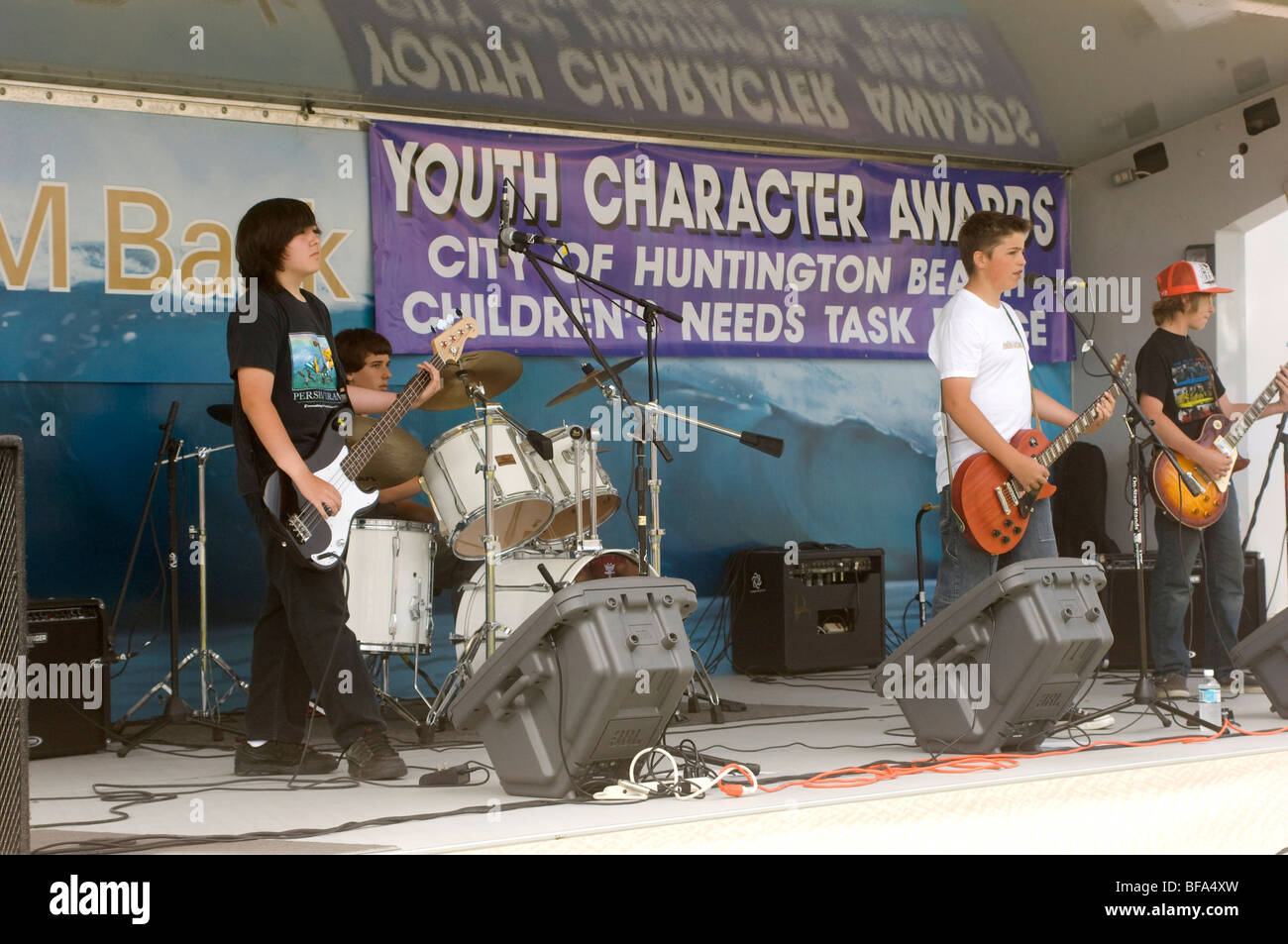 A band of young teenage musicians play a concert at Huntington Beach ...