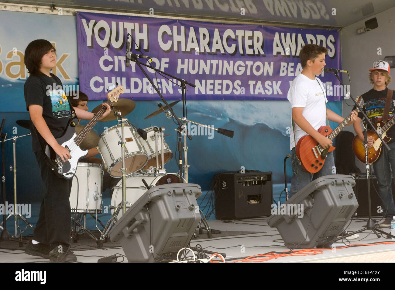 A band of young teenage musicians play a concert at Huntington Beach ...