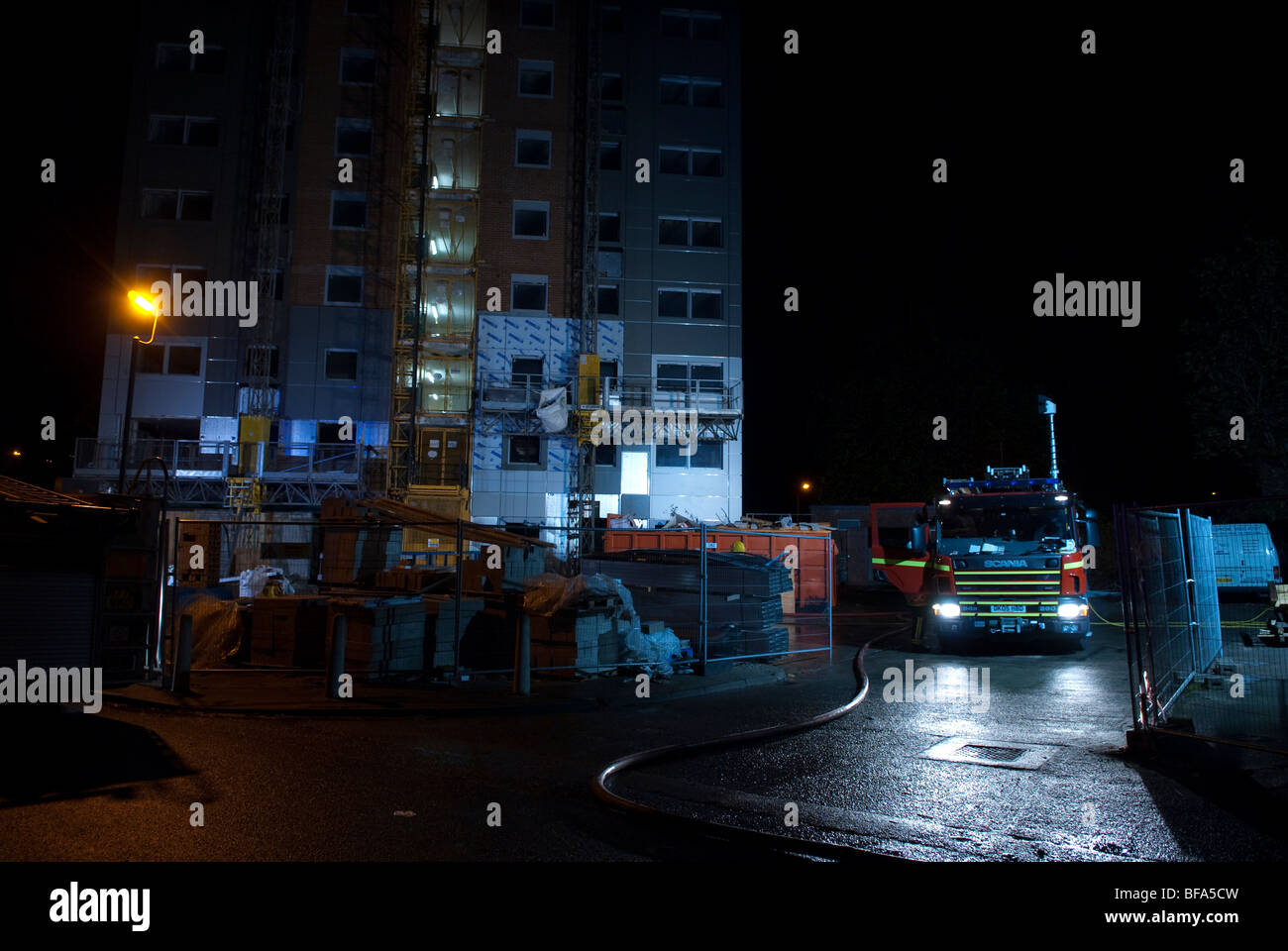 Fire engine at block of flats on fire at night Stock Photo - Alamy