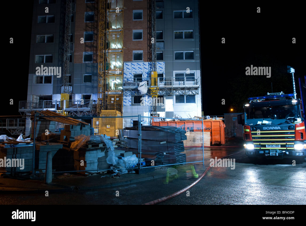 Fire engine at Tower block on fire at night Stock Photo - Alamy