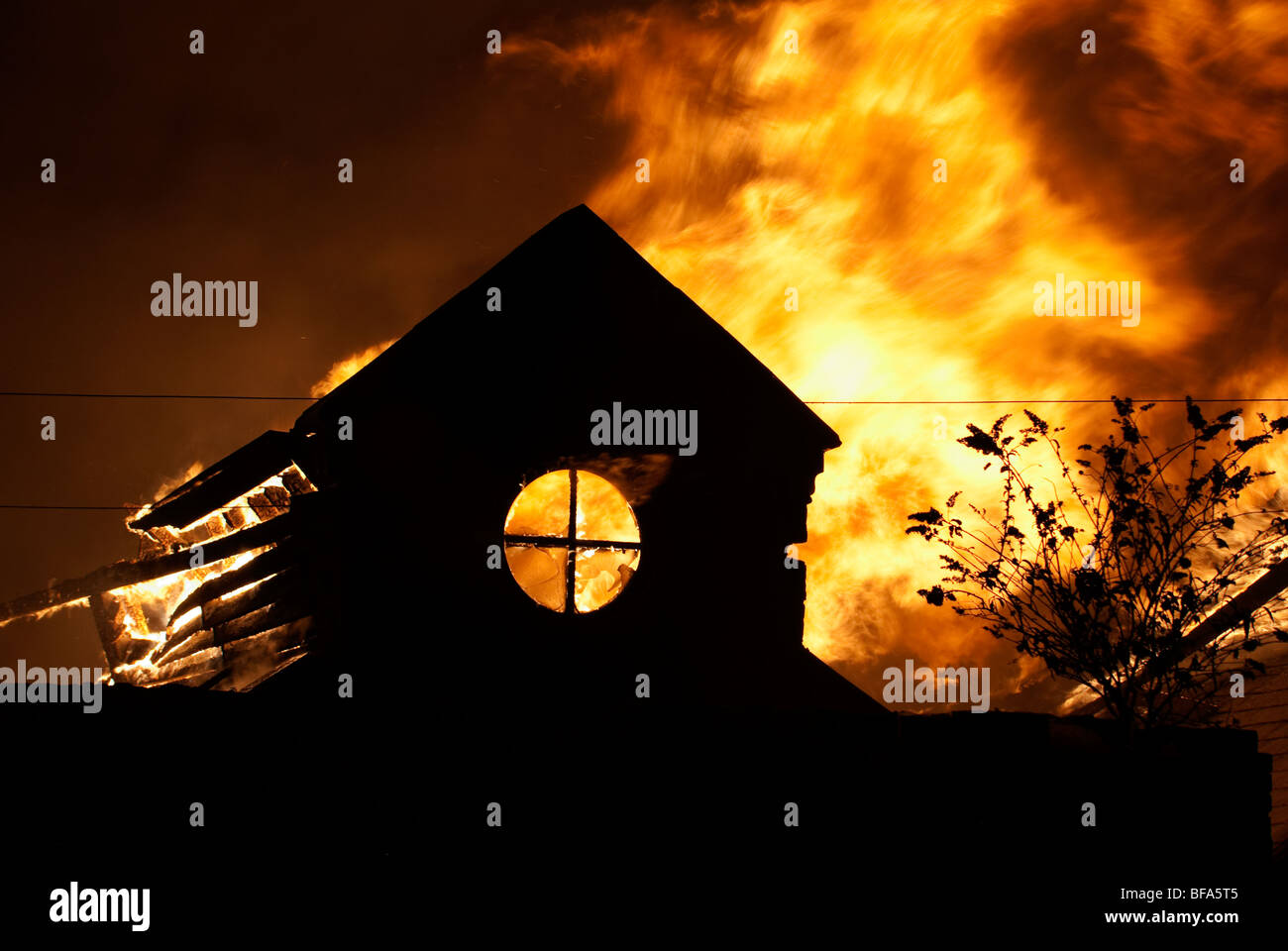 Flames in high winds from Factory Fire Stock Photo - Alamy